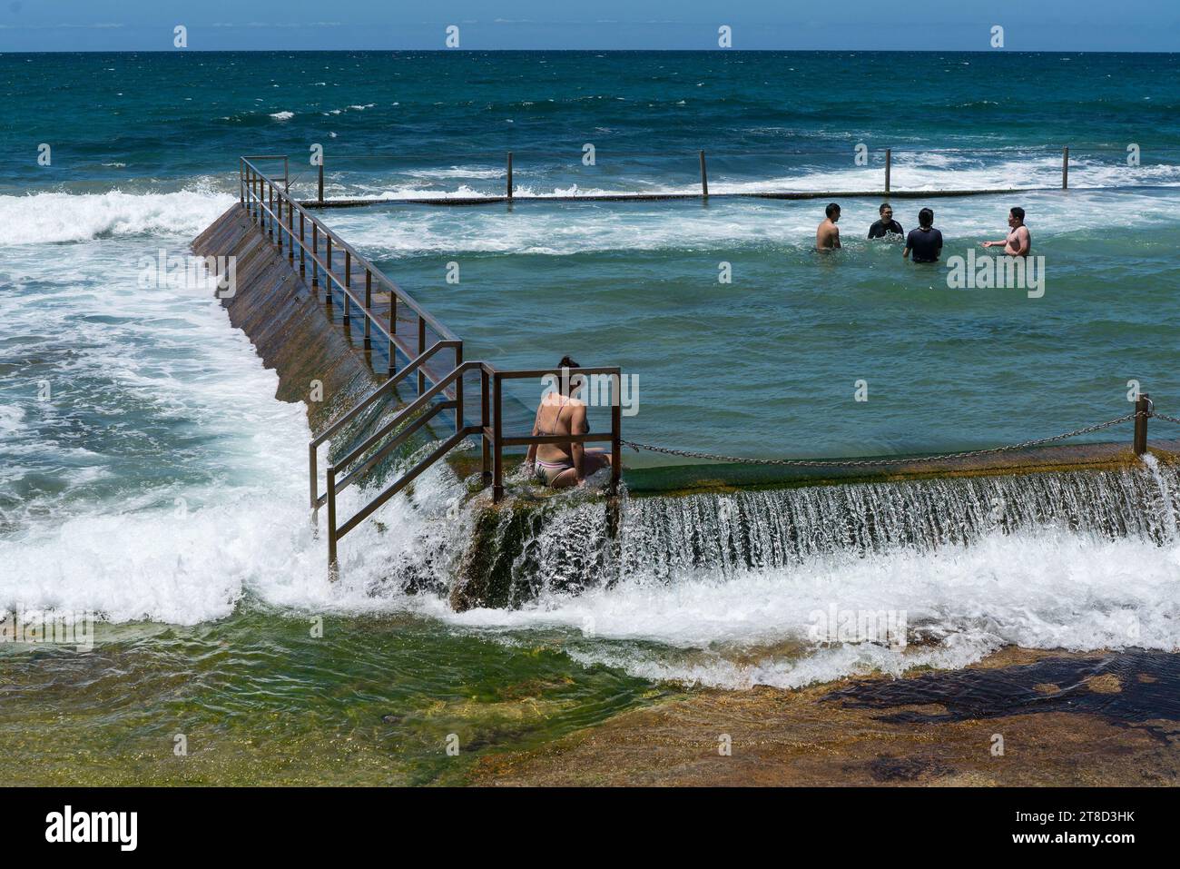Water overflows the edge of the ocean pool at Cronulla Beach Sydney ...