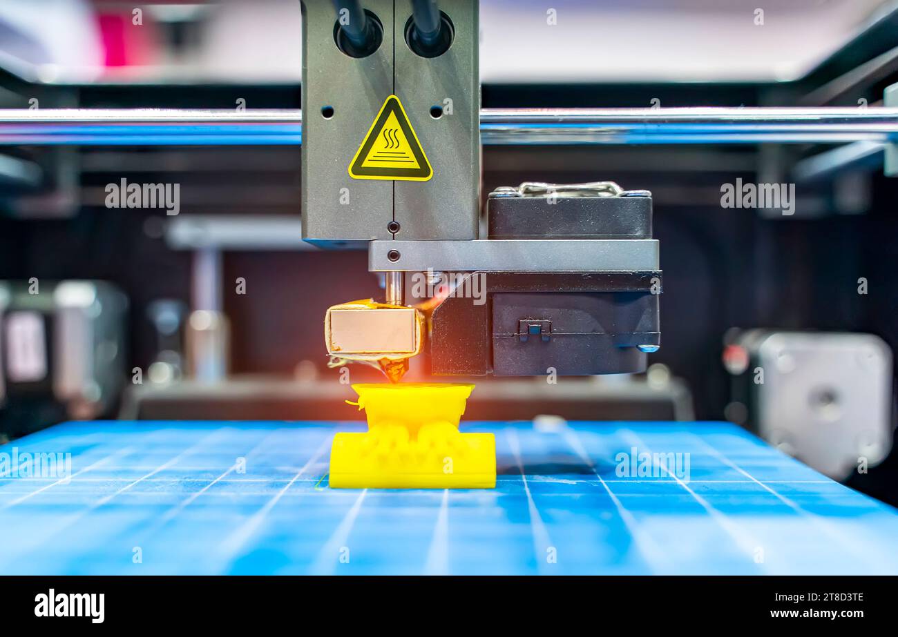 3D printer or additive manufacturing and robotic automation technology ...