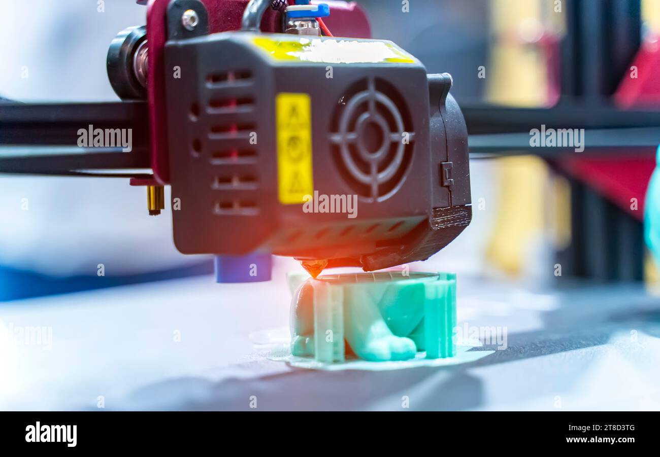 3D printer or additive manufacturing and robotic automation technology ...