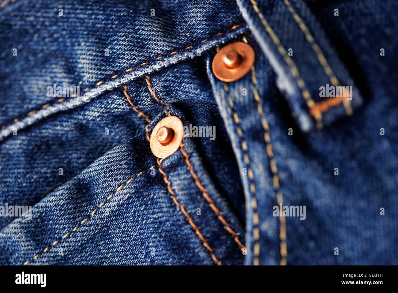 Close up of details of new Jeans. Buttons and seams and pockets close ...