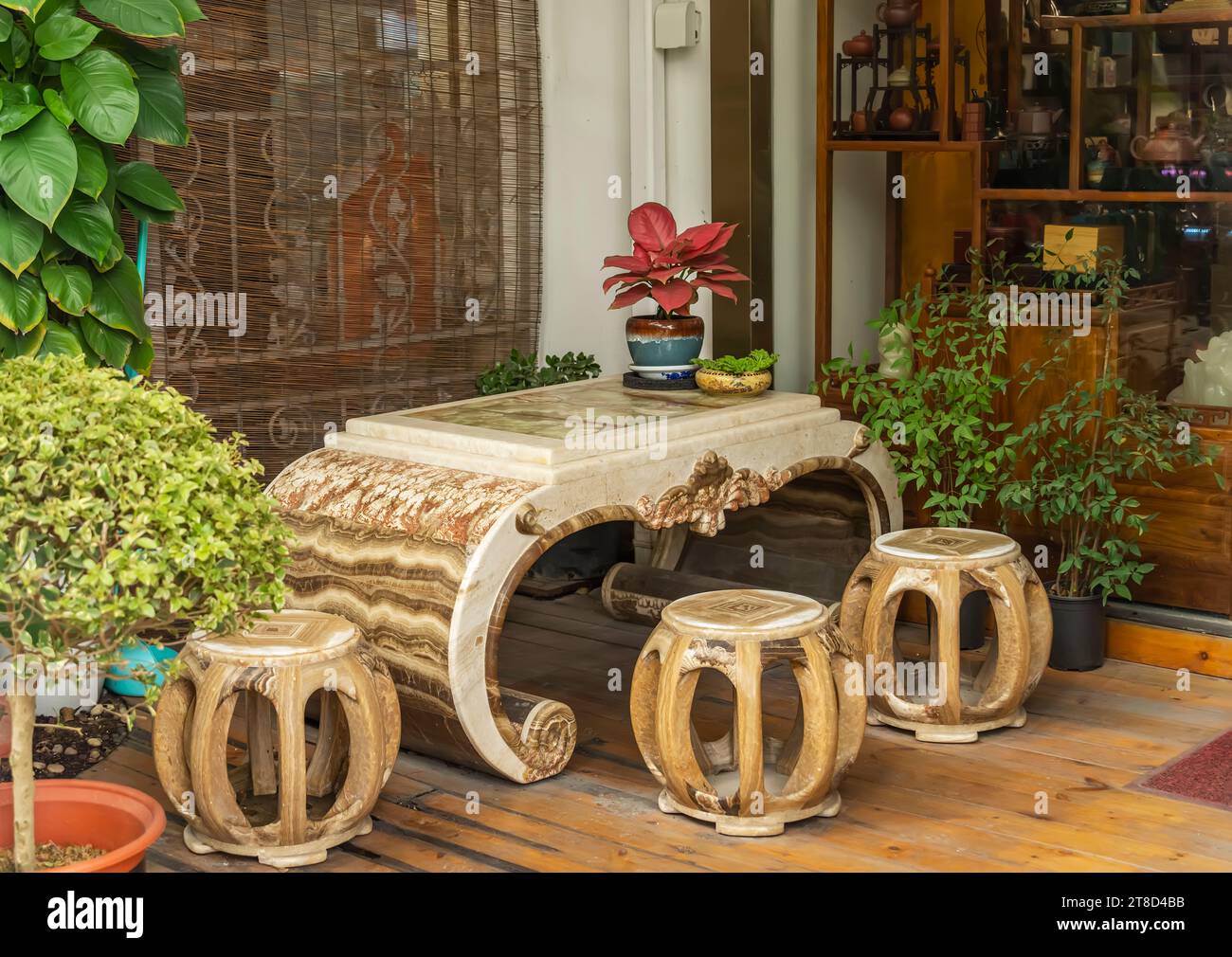Stone table with stone benches set with traditional design in garden ...