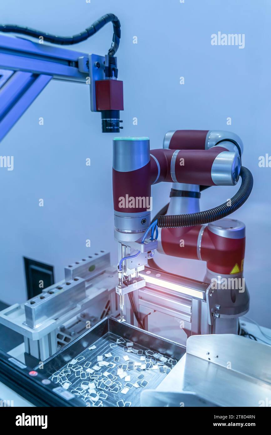 robot drill machine tool with camera at industrial manufacture factory ...