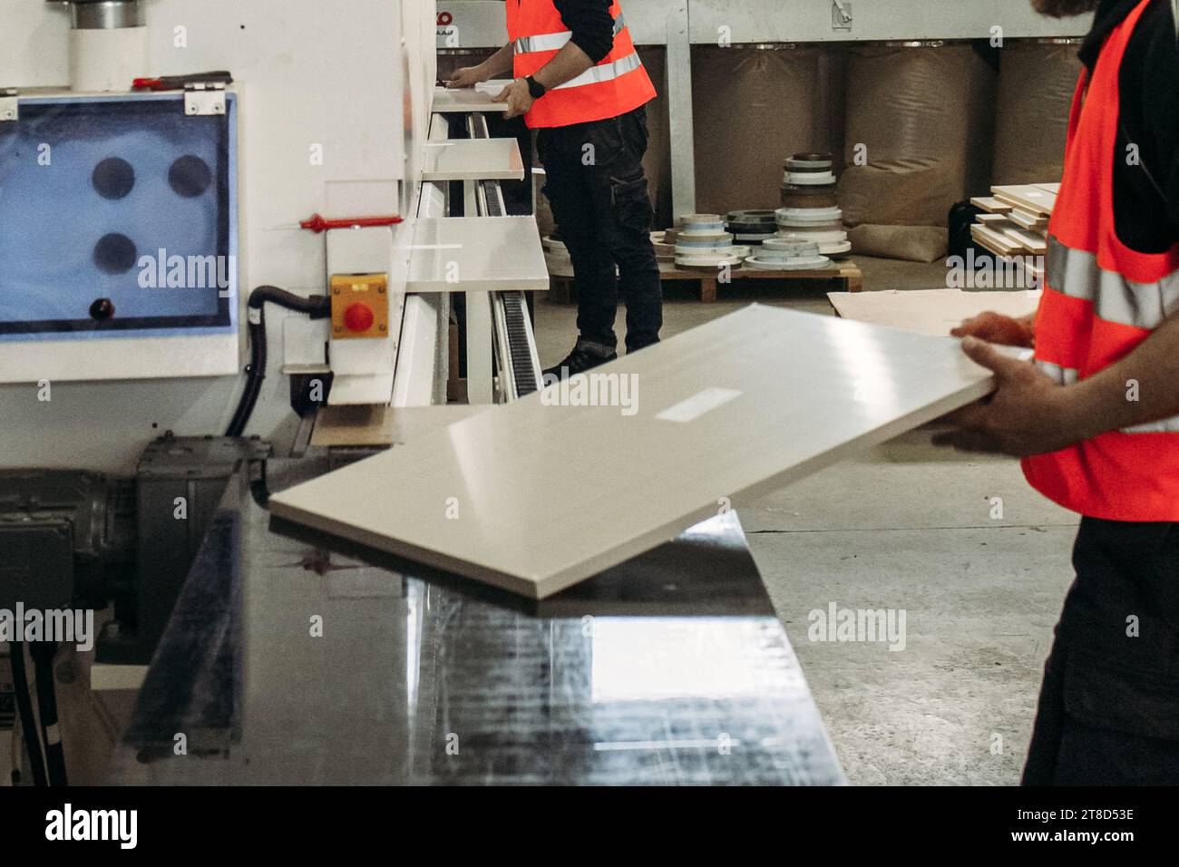 Furniture factory. Wooden MDF parts moving along a specially equipped ...