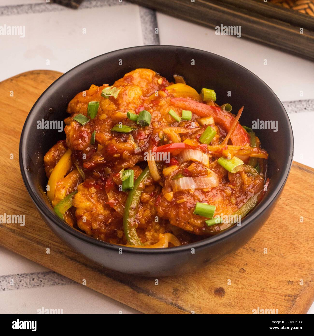 Close-up chilli fish food,Chilli fish in black bowl white background ...