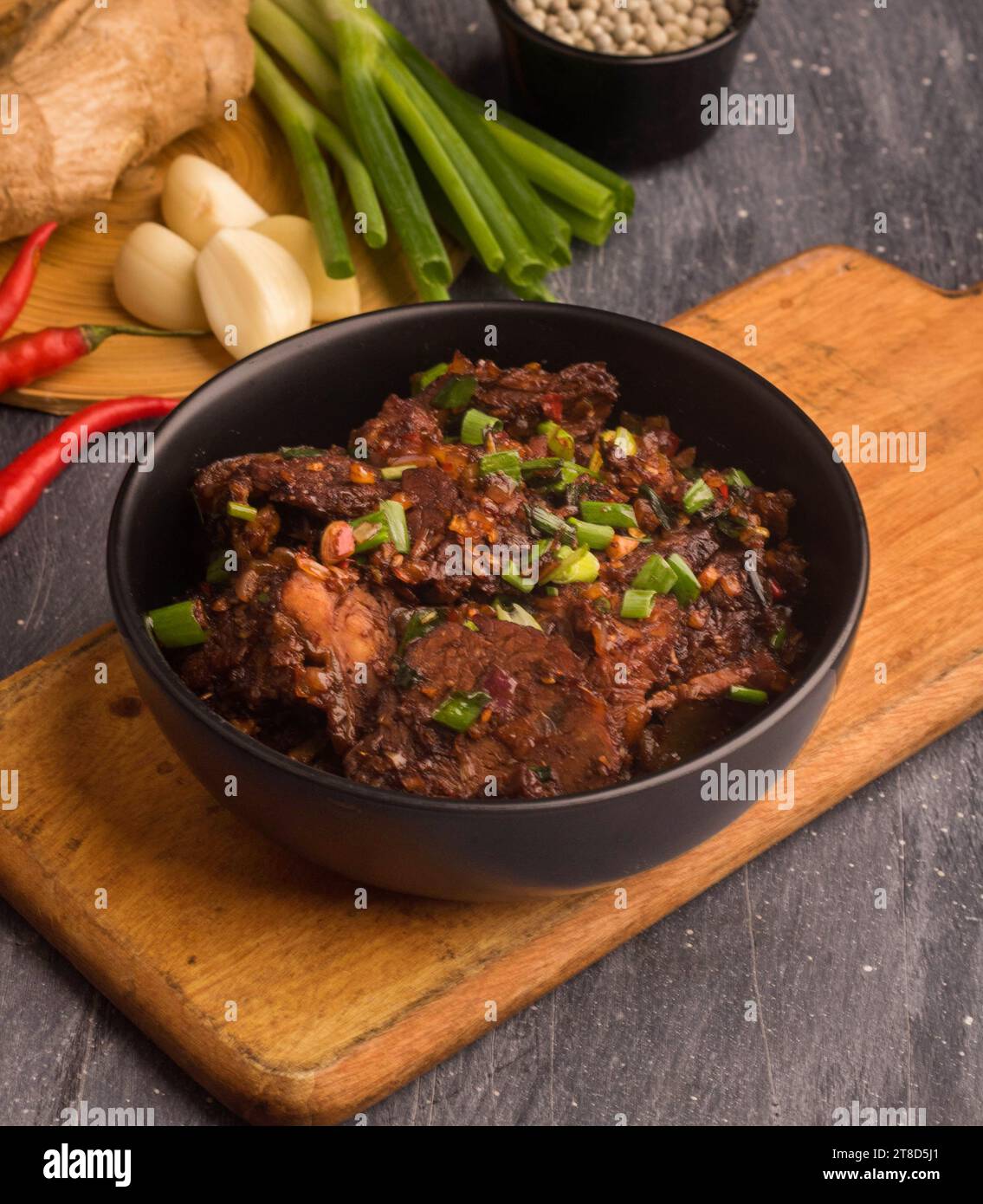 Sliced roasted beef food,Roasted beef leeks black bowl on black ...