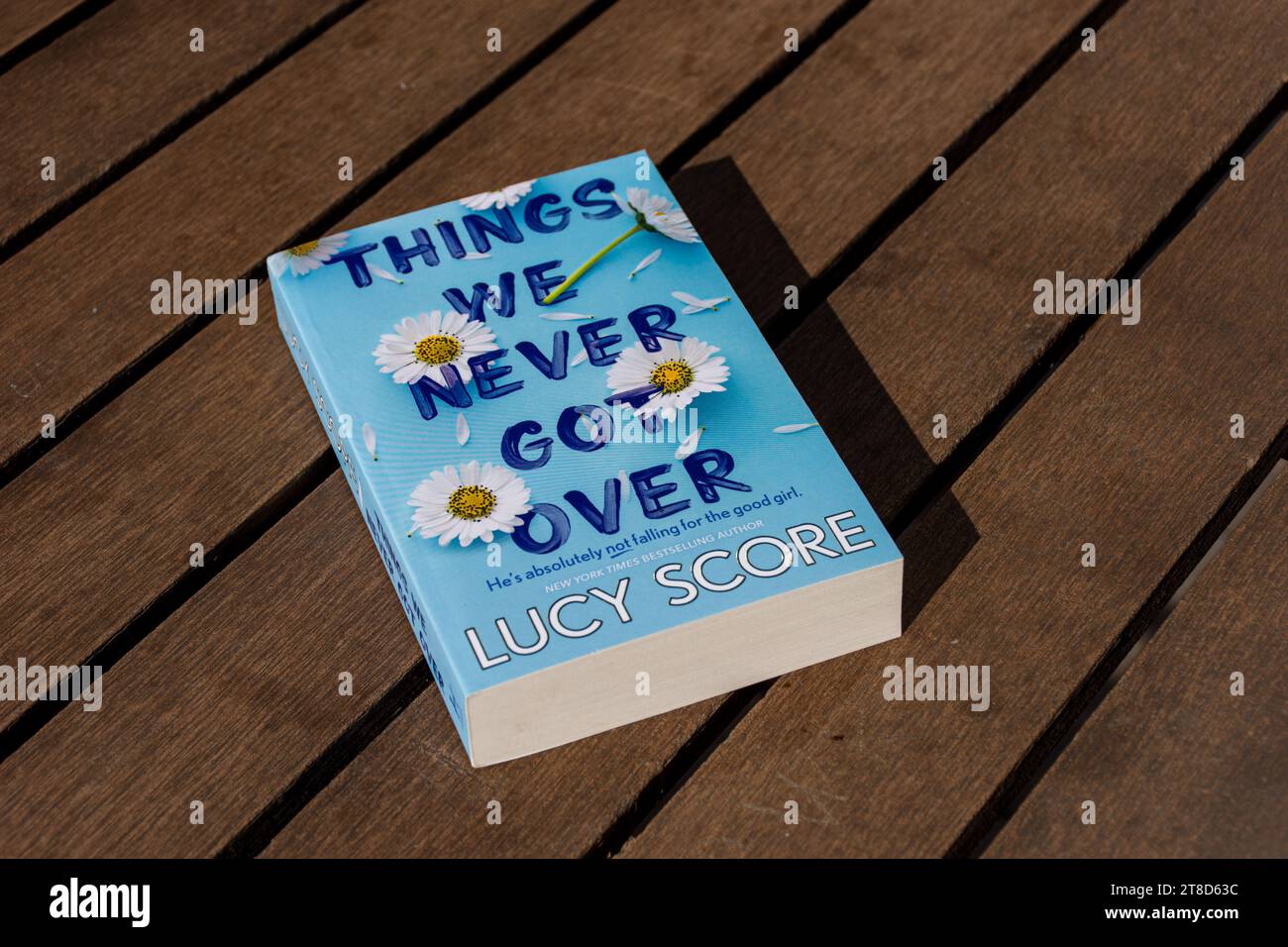 Close-up Lucy Score's Things We Never Got Over book on a wooden table ...