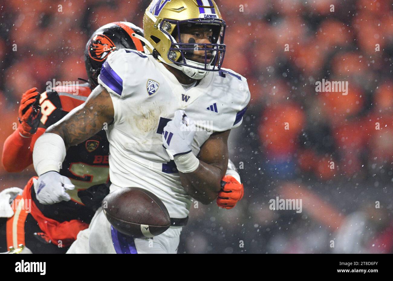 Oregon State defensive back Kitan Oladapo (28) strips the ball from ...