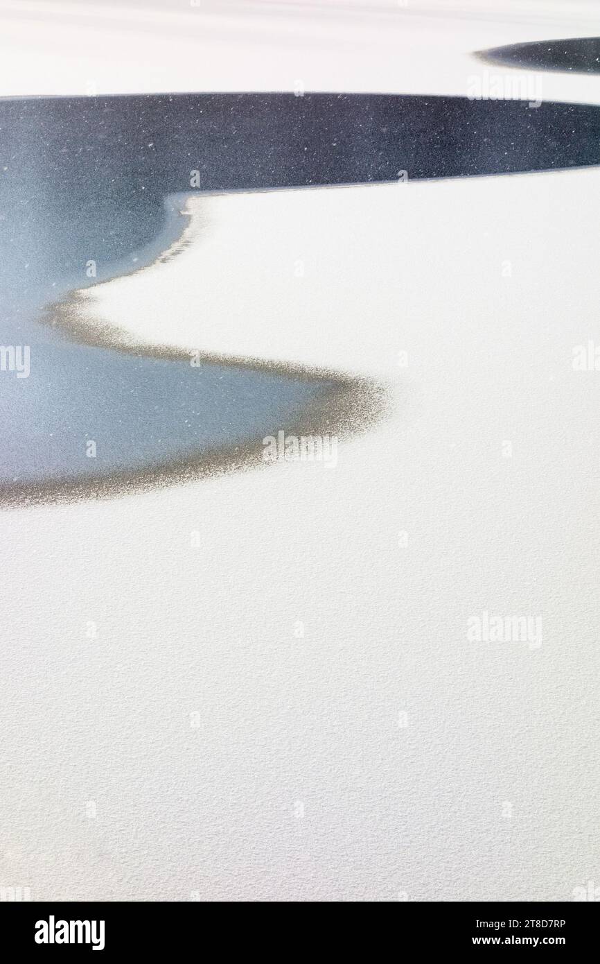 Melted water puddle on the lake Stock Photo - Alamy