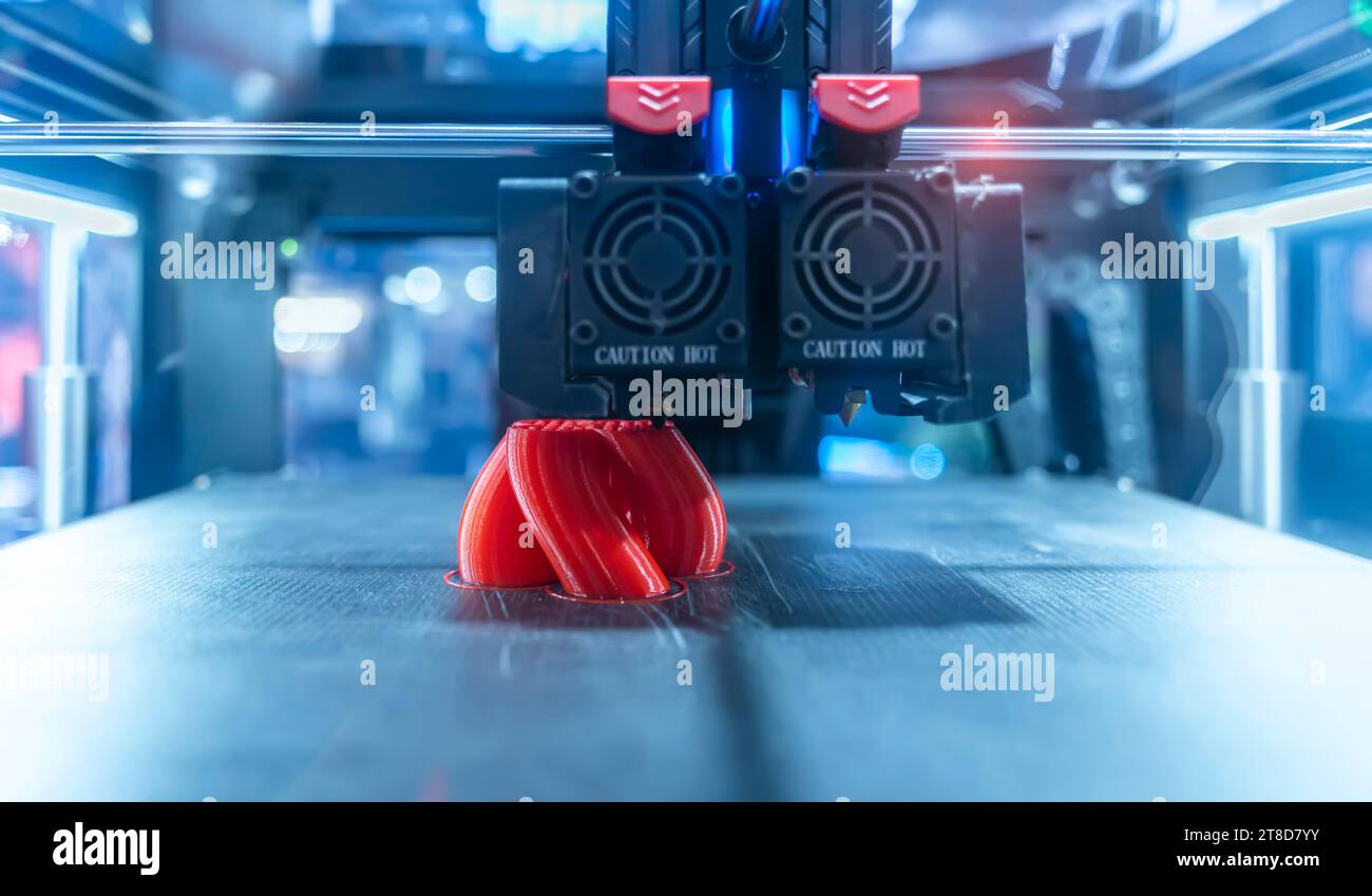 3D printer or additive manufacturing and robotic automation technology ...
