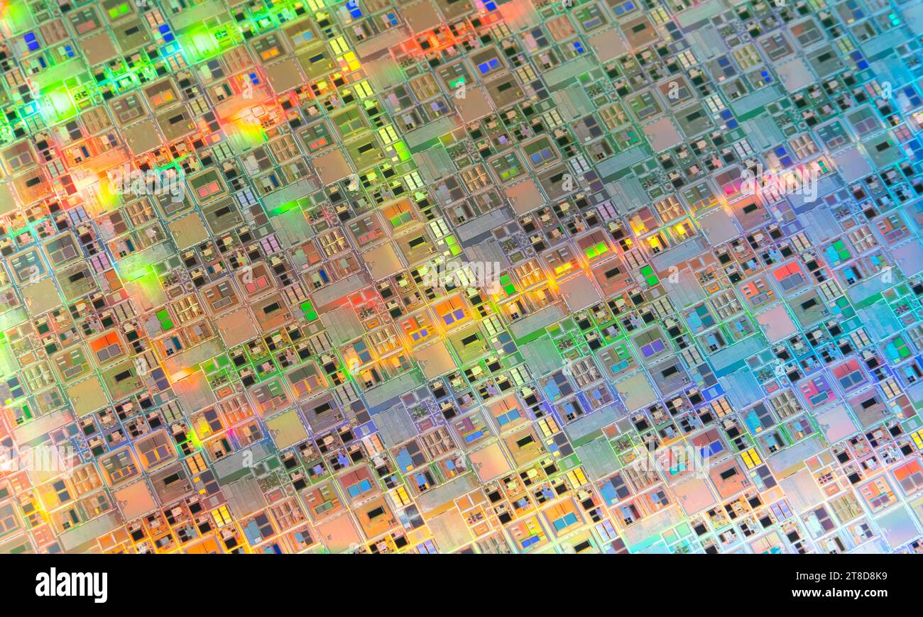 silicon wafer with microchips reflecting different colors Stock Photo ...