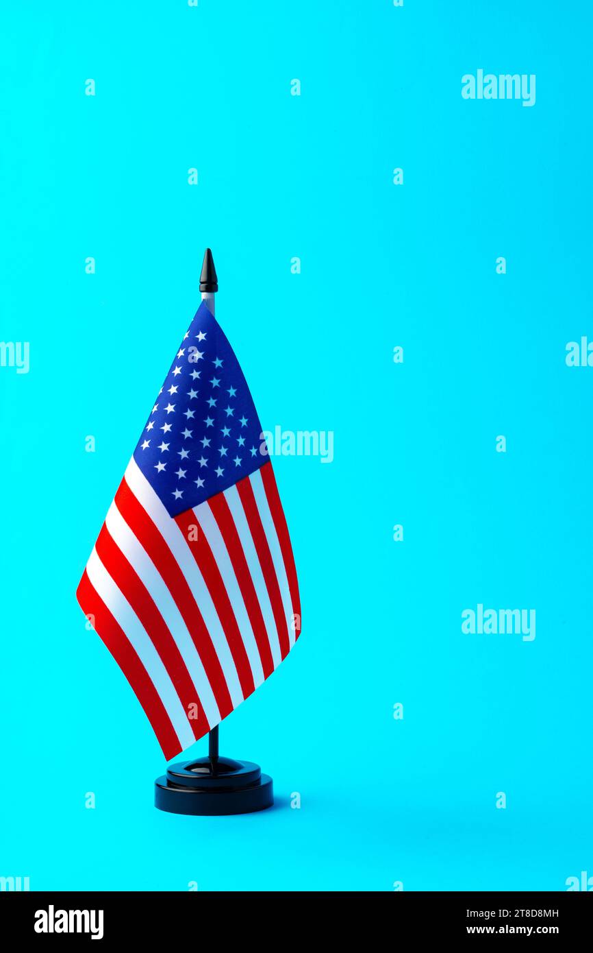 Small flag of USA on flagpole on studio background Stock Photo - Alamy