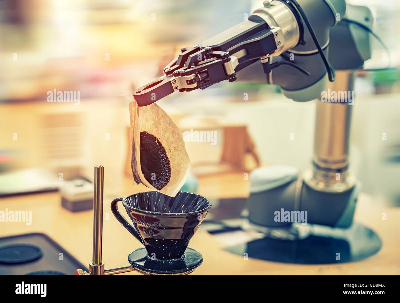 automatic robot arm preparing coffee with coffee machine Stock Photo ...