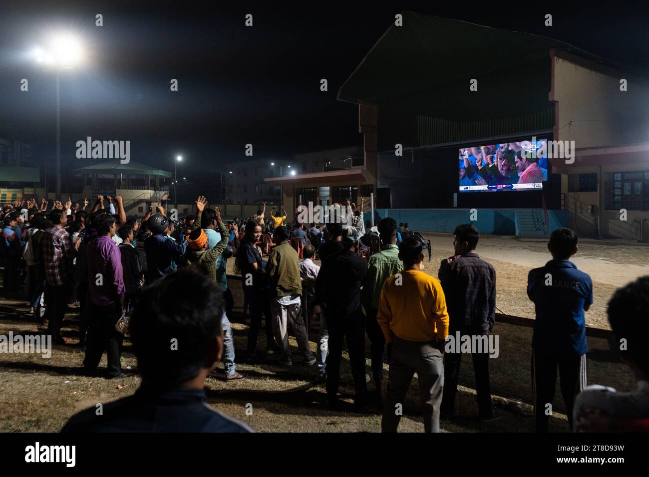 Guwahati, Assam, India. 19th Nov, 2023. Cricket fans in a field watch ...