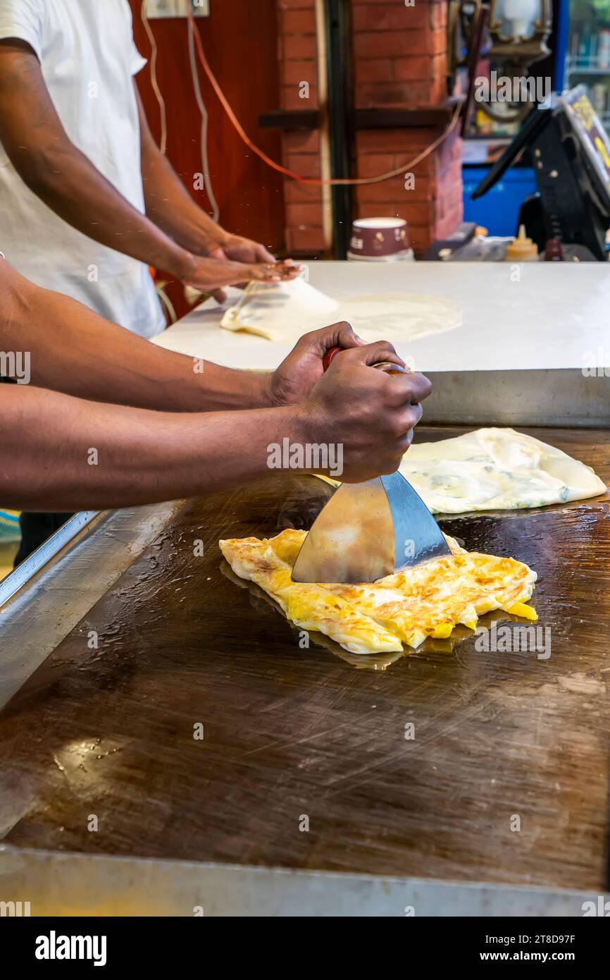 Indian man making roti hi-res stock photography and images - Alamy