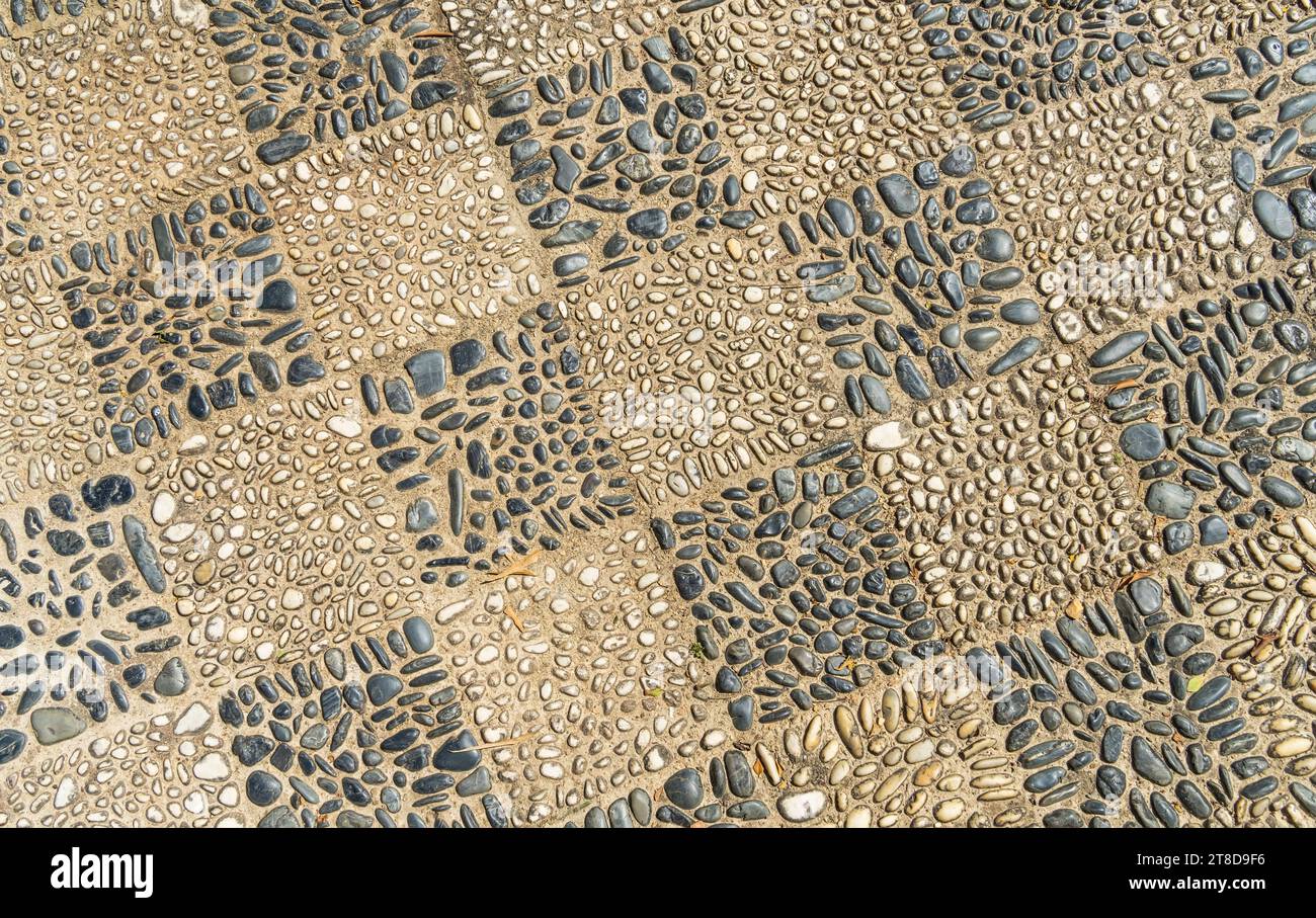 background made of walkway with pebbles Stock Photo - Alamy