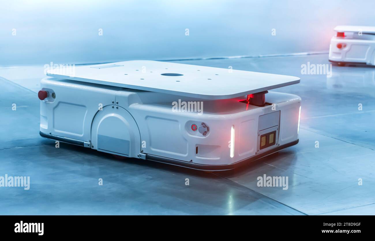 warehouse robot car carries cardboard box assembly in factory Stock ...