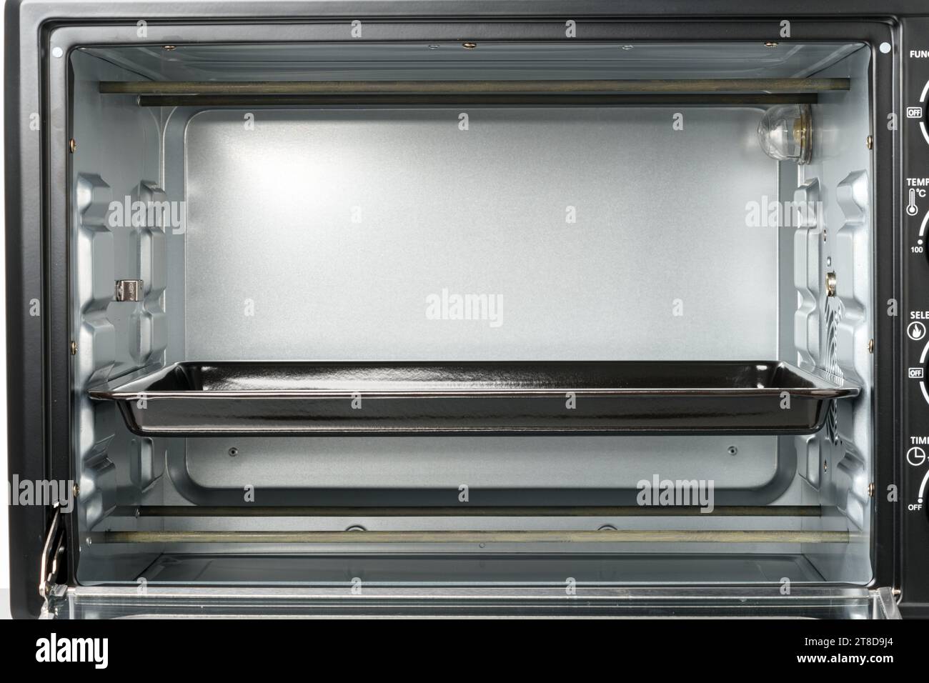 Inside of empty mini electric stove oven Stock Photo - Alamy