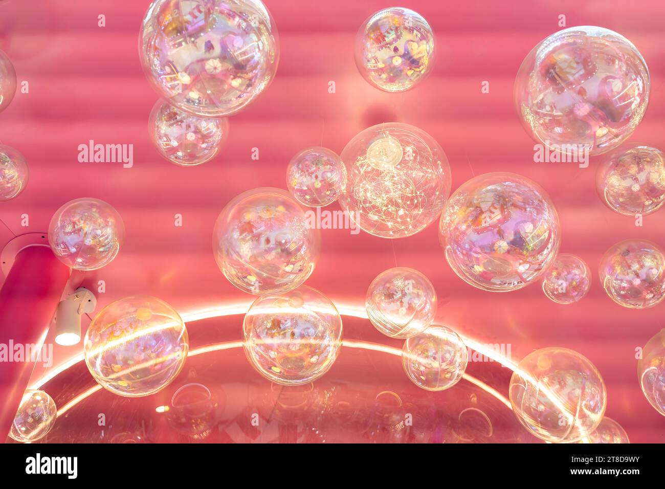 glass bubble decoration tied rope hanging on ceiling Stock Photo - Alamy