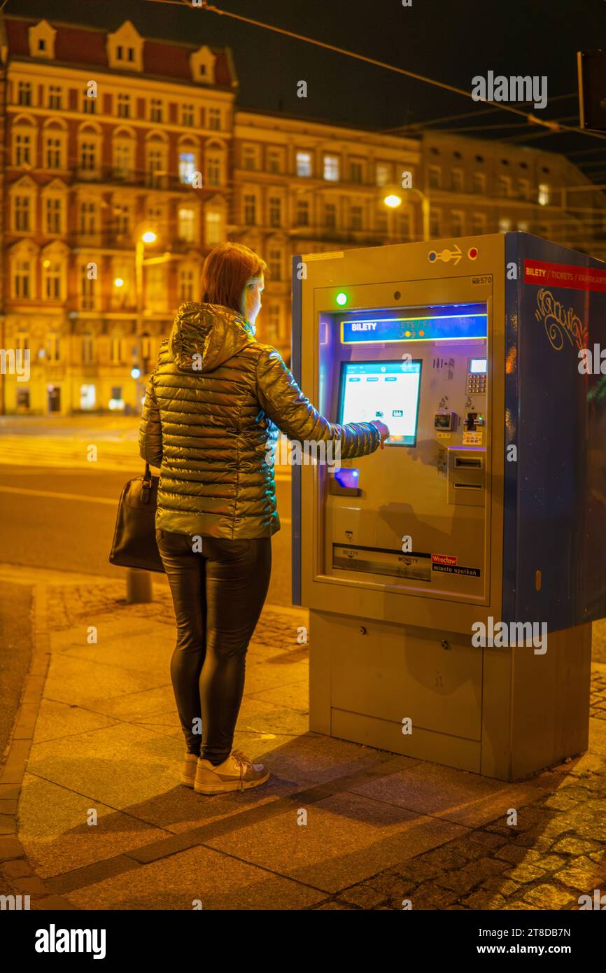 Wroclaw, Poland - November 10, 2023: woman buying bus ticket at the mpk ...