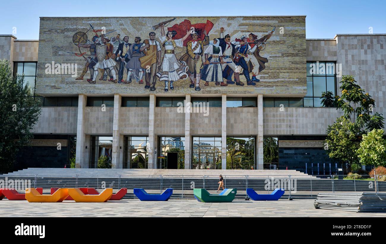 A woman walks past the National History Museum, Muzeu Historik Kombëtar ...