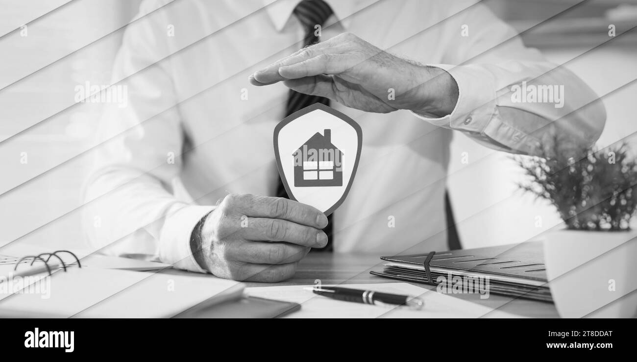 Concept of home insurance with paper shield protected by hand of ...