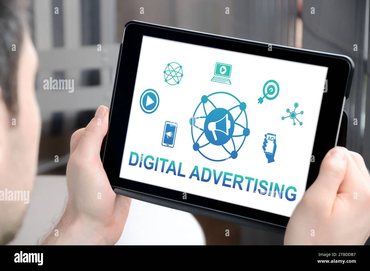 Man holding a tablet showing digital advertising concept Stock Photo ...