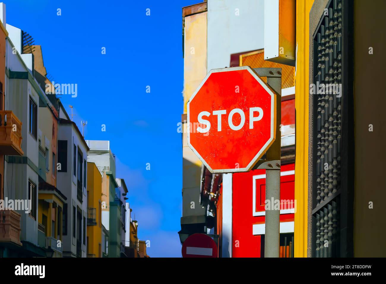 Stop sign on the street in the city. Classic red stop sign positioned ...