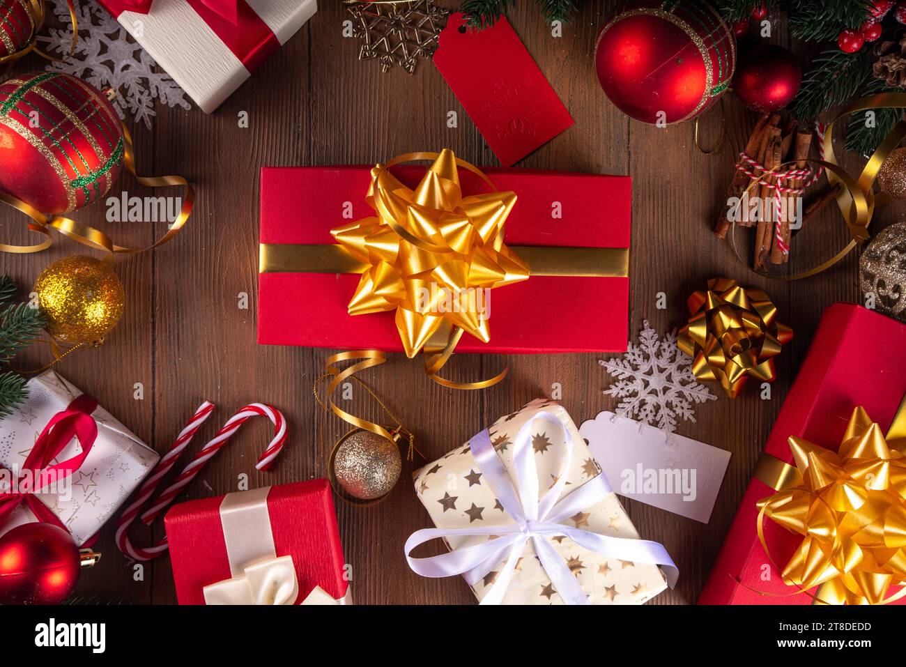 Decorating Christmas gifts background. Mother and child hands wrapping ...