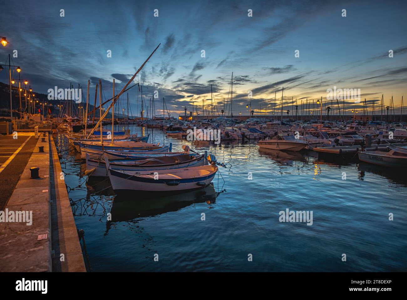 Yachts and boats in the harbour of Menton, in front of colorful ...
