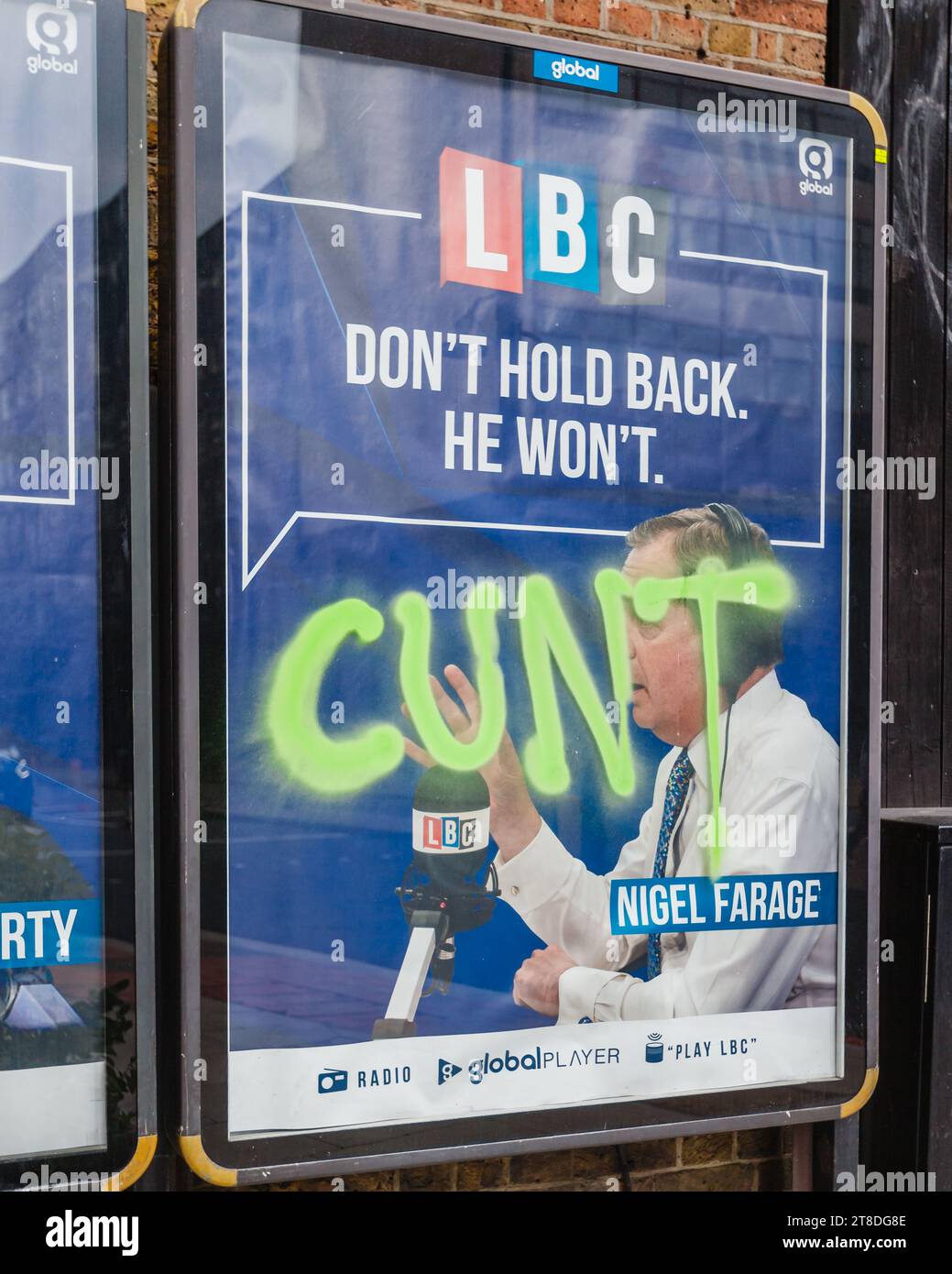 A defaced poster of Nigel Farage during the lockdown in London Stock ...