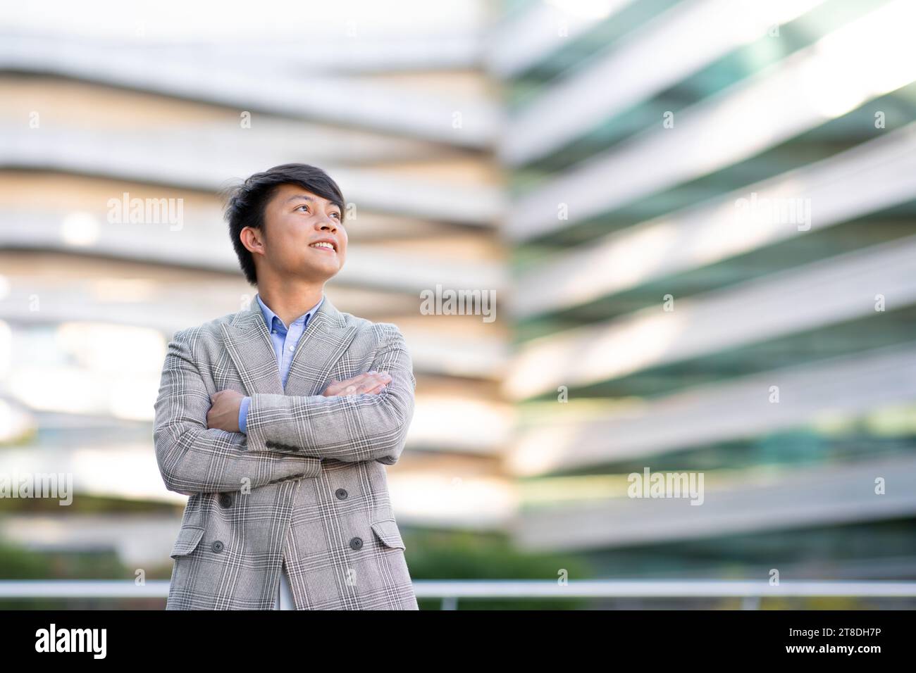 Confident Korean CEO businessman stands outside the corporate office ...
