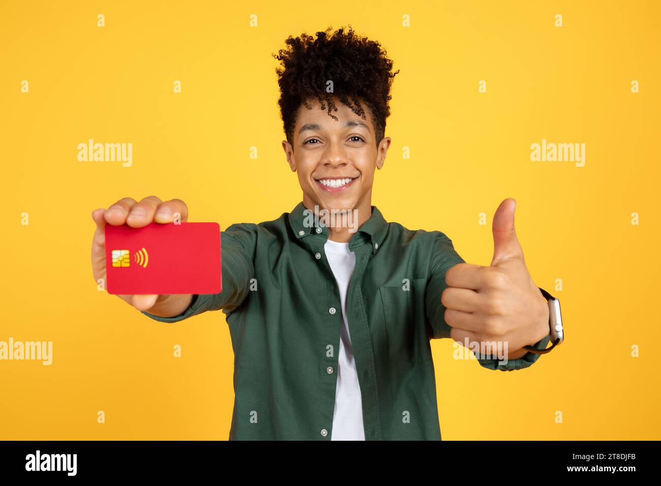 Happy african american guy showing bank credit card Stock Photo - Alamy
