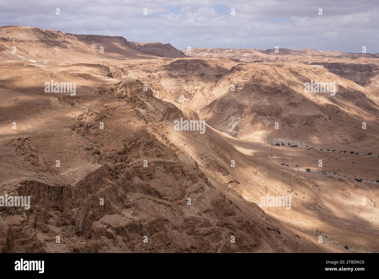 A scenic landscape of arid mountains in the desert, stretching out into ...