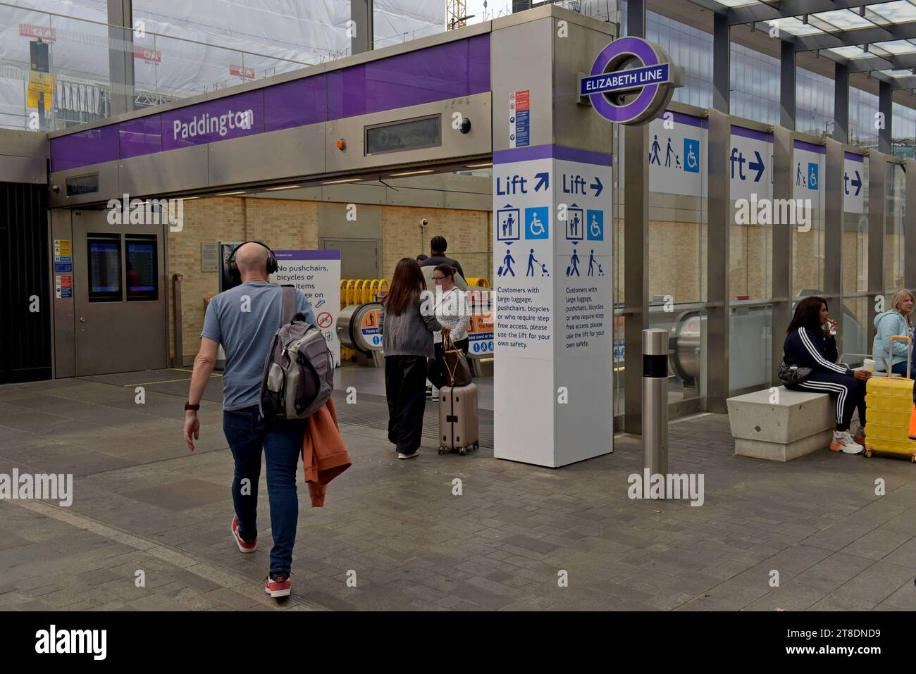 People entering to catch a train at the entrance to the Elizabeth Line ...