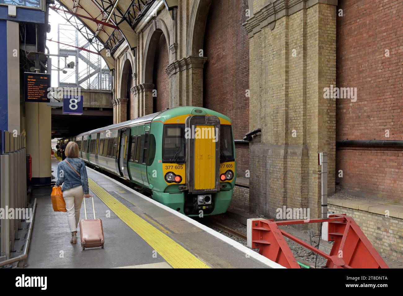 People catching trains at Victoria Railway Station, London, August 2023 ...