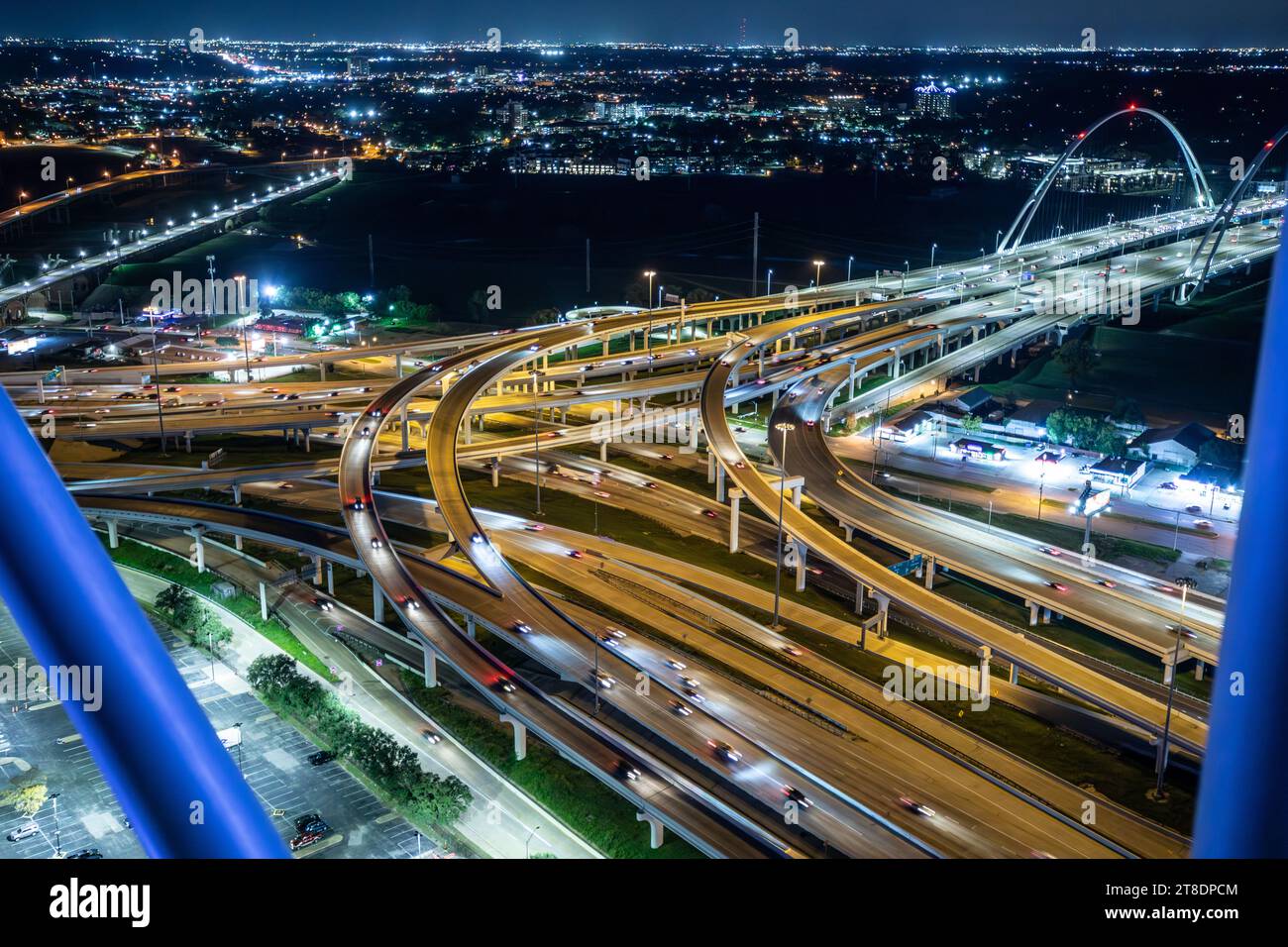 scenic skyline of Dallas by night with view to the highways and bridges ...