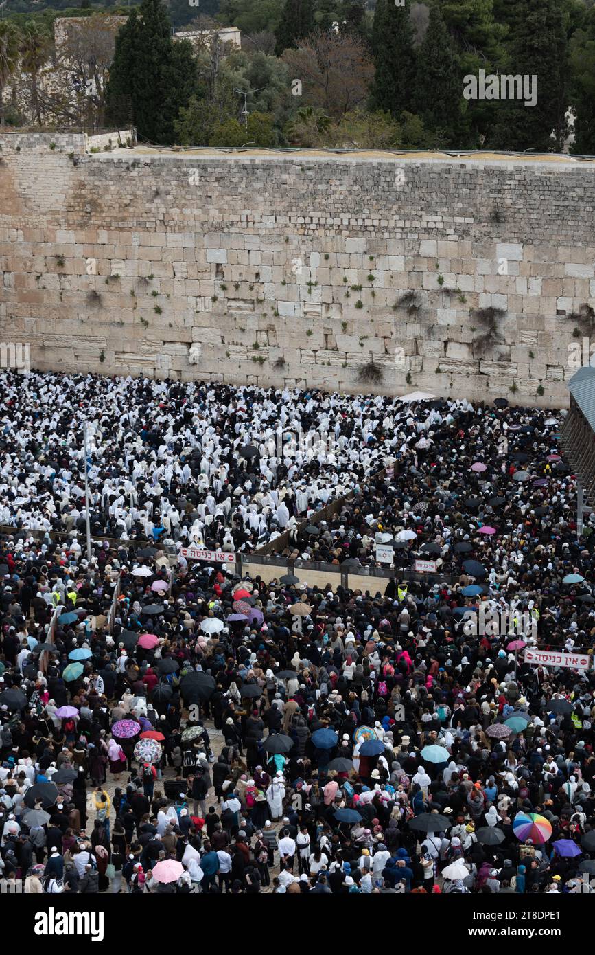 Jewish worshippers crowd into the prayer section below the Western Wall ...