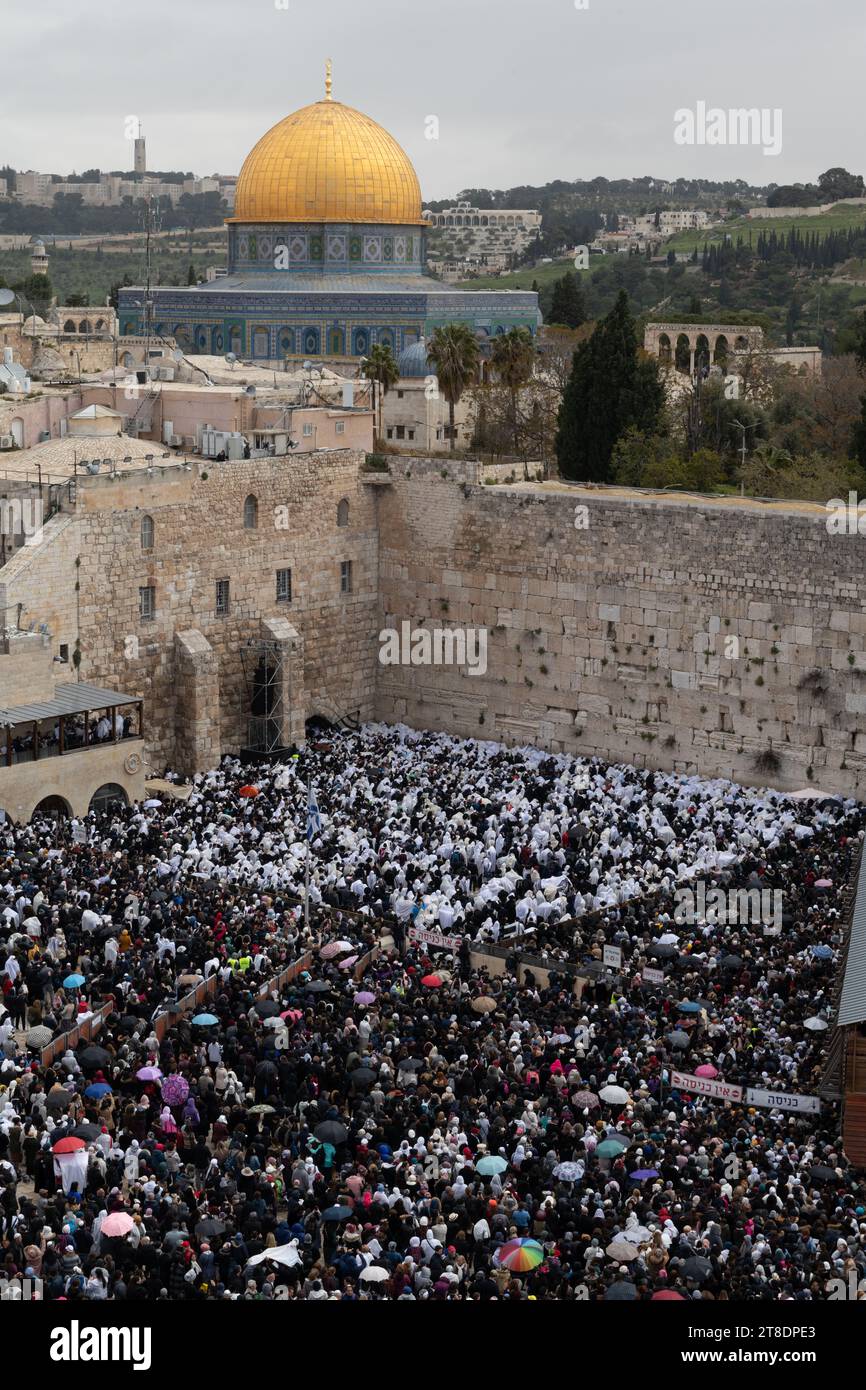 Jewish worshippers crowd into the prayer section below the Western Wall ...
