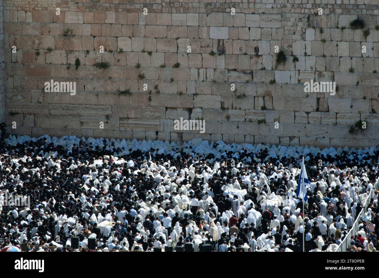 Jewish worshippers crowd into the prayer section below the Western Wall ...