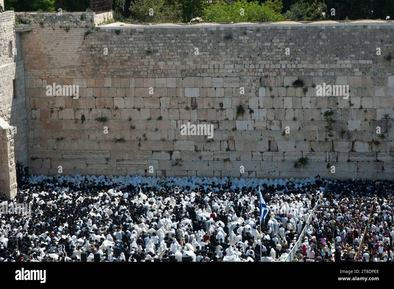 Jewish worshippers crowd into the prayer section below the Western Wall ...