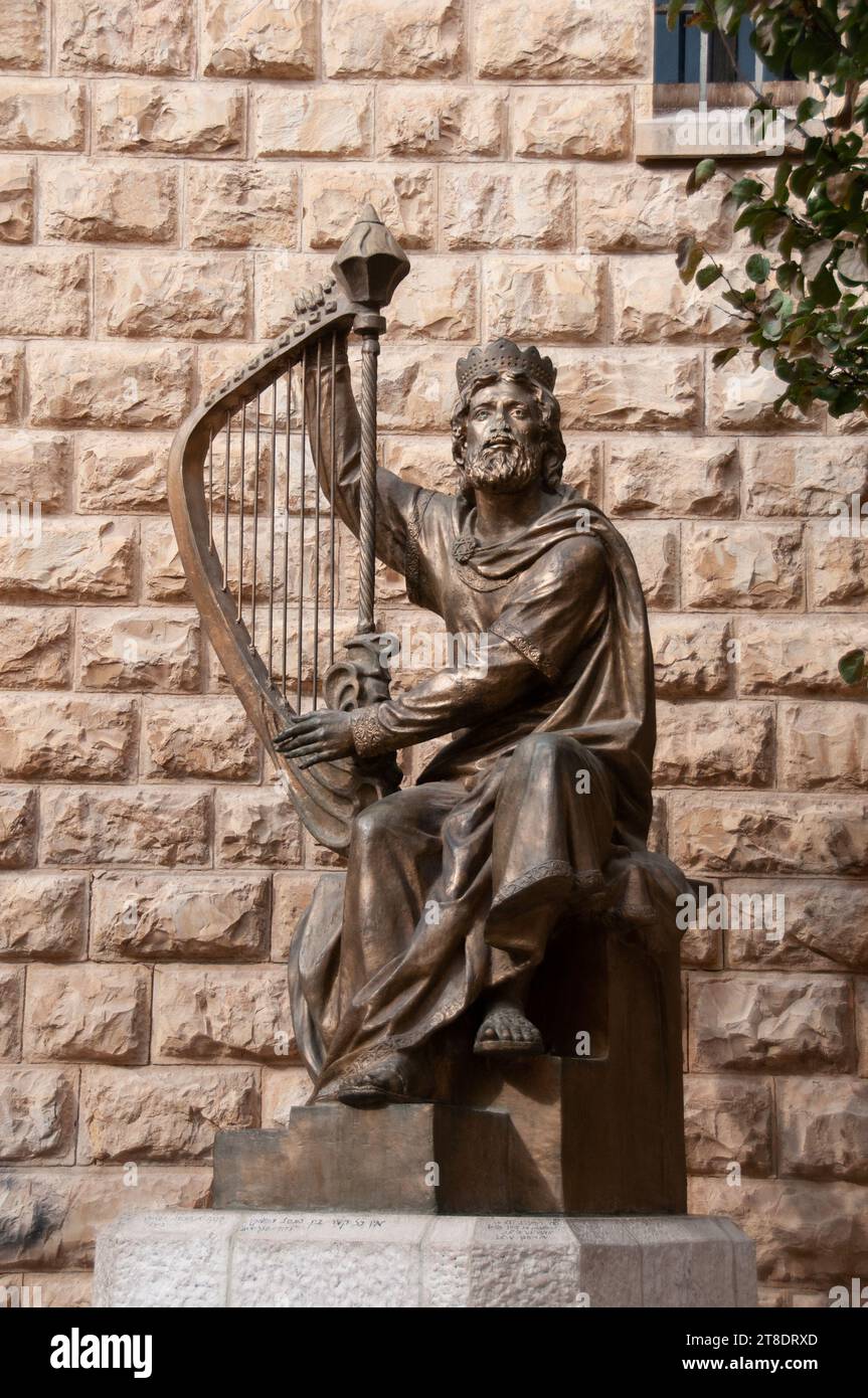 Bronze statue of King David playing the harp outside his tomb in the ...