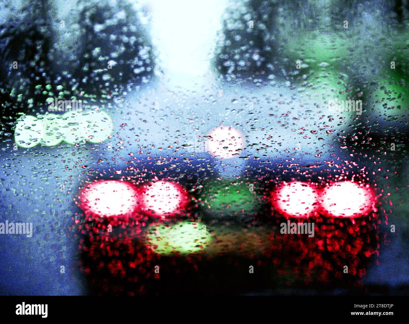 Wet windshield and a car in front Stock Photo - Alamy