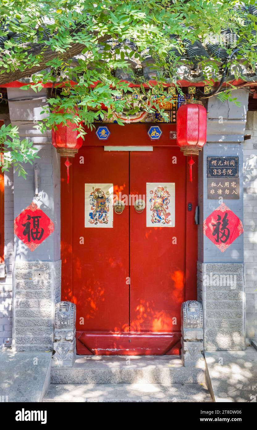 Colorful red door on a historic house in the hutongs of Beijing, China ...