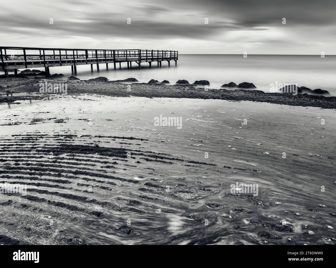 Puddle on the beach of the Santa Pola salt flats Stock Photo - Alamy