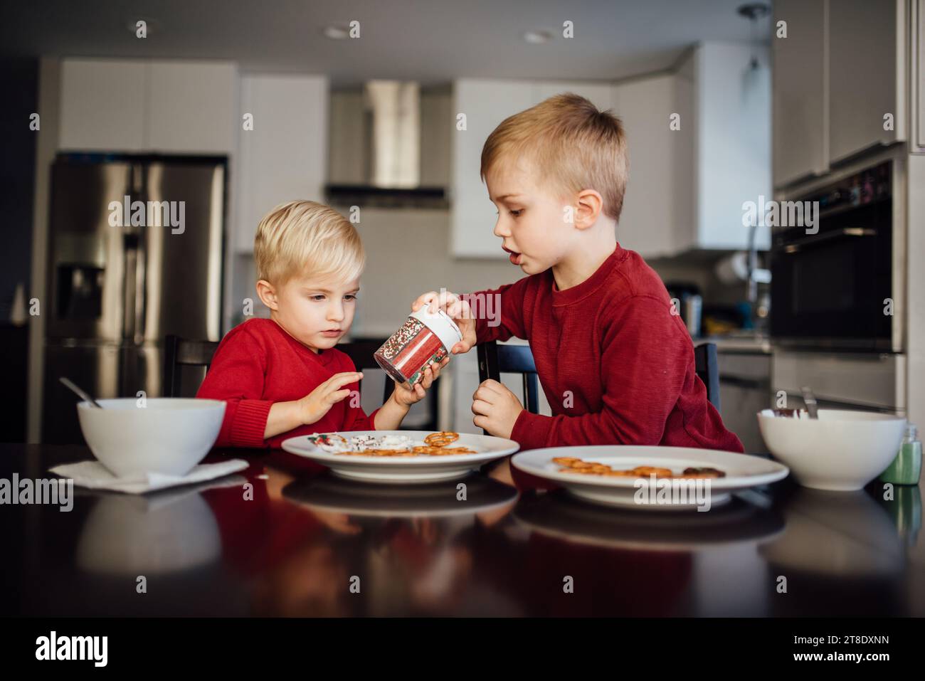 Boy helping younger brother hi-res stock photography and images - Alamy