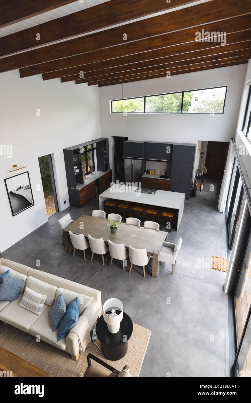 Big empty modern kitchen and living room with wooden table, white ...