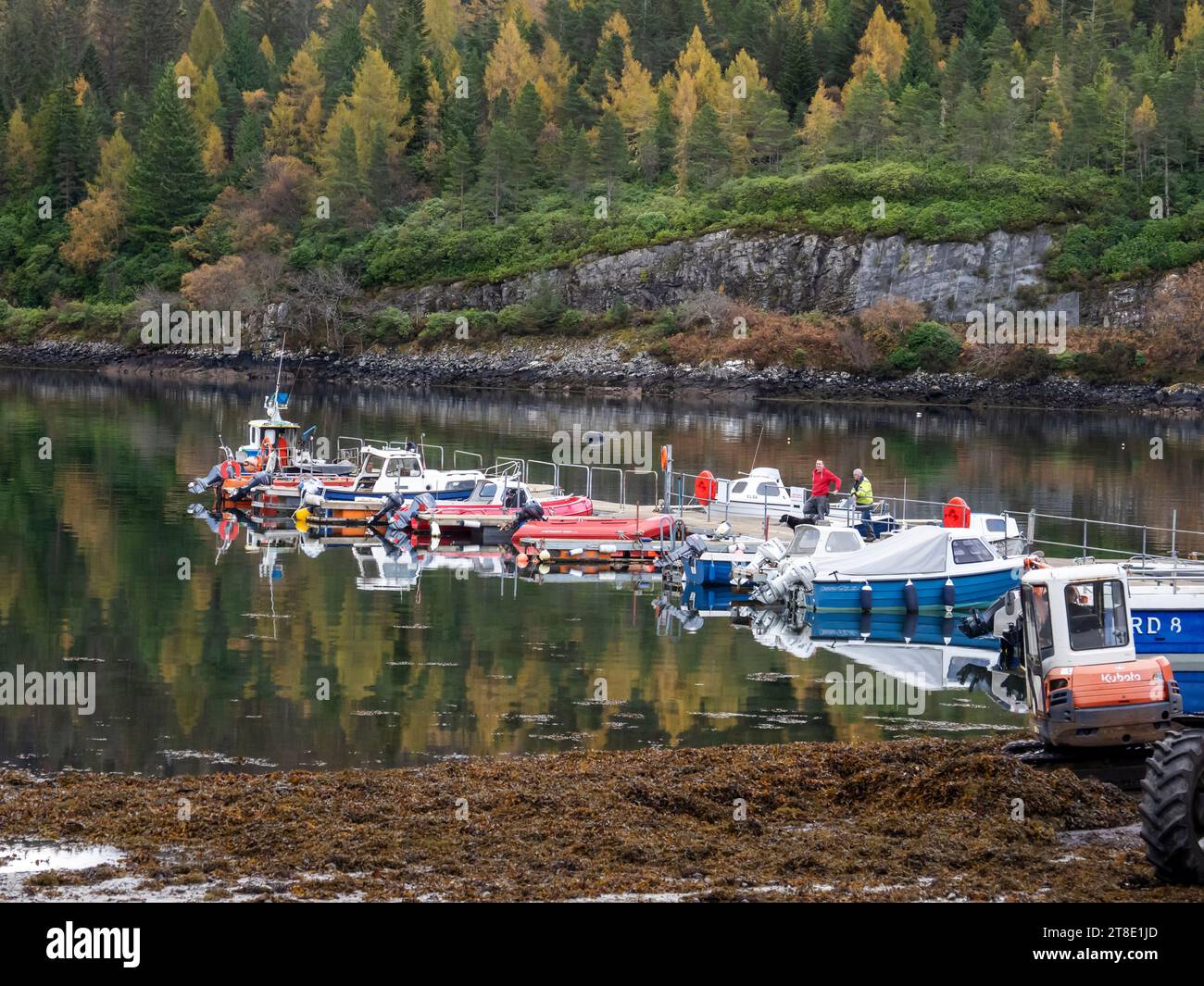 Boats moored at a jetty in Plockton, Highlands, Scotland, UK Stock ...