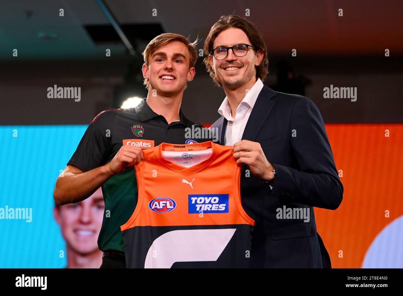 Phil Davis presents James Leake with a GWS guernsey during the first ...