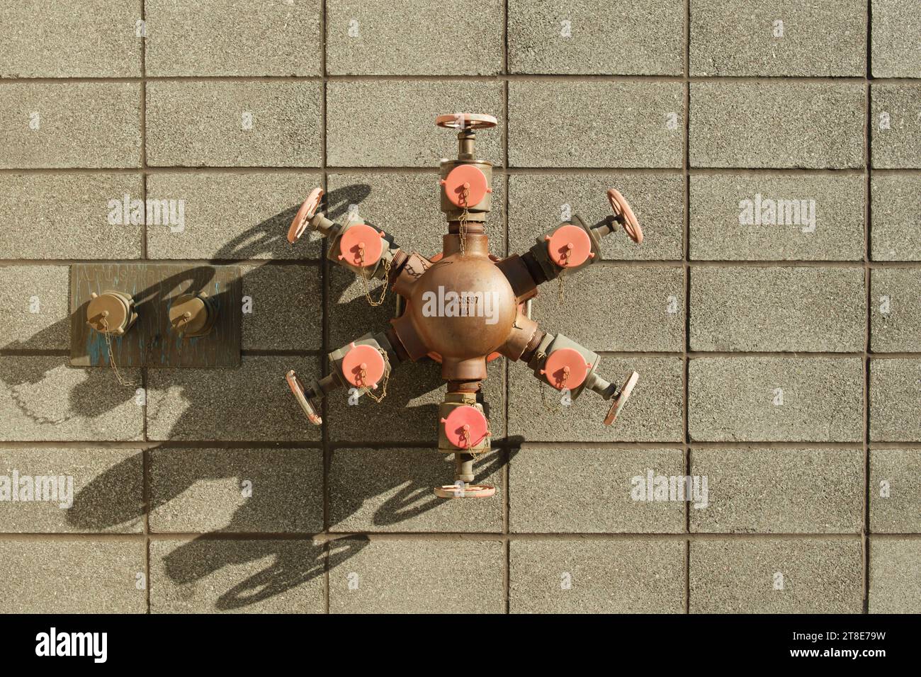 Wall-mounted water valves on a building at Michigan State University ...