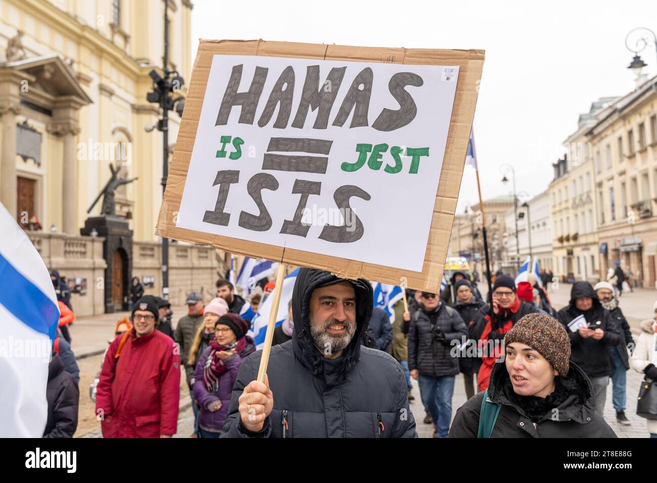 A demonstrator holds a sign reading HAMAS IS ISIS as he takes part in a ...